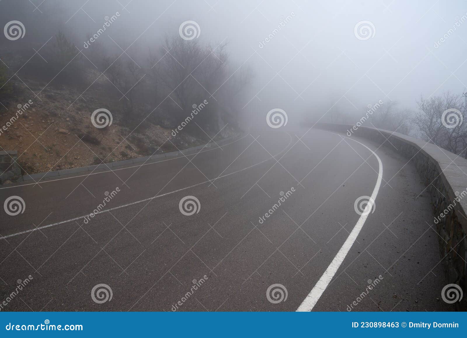 A Curved Asphalt Road Going into the Fog Stock Image - Image of ...