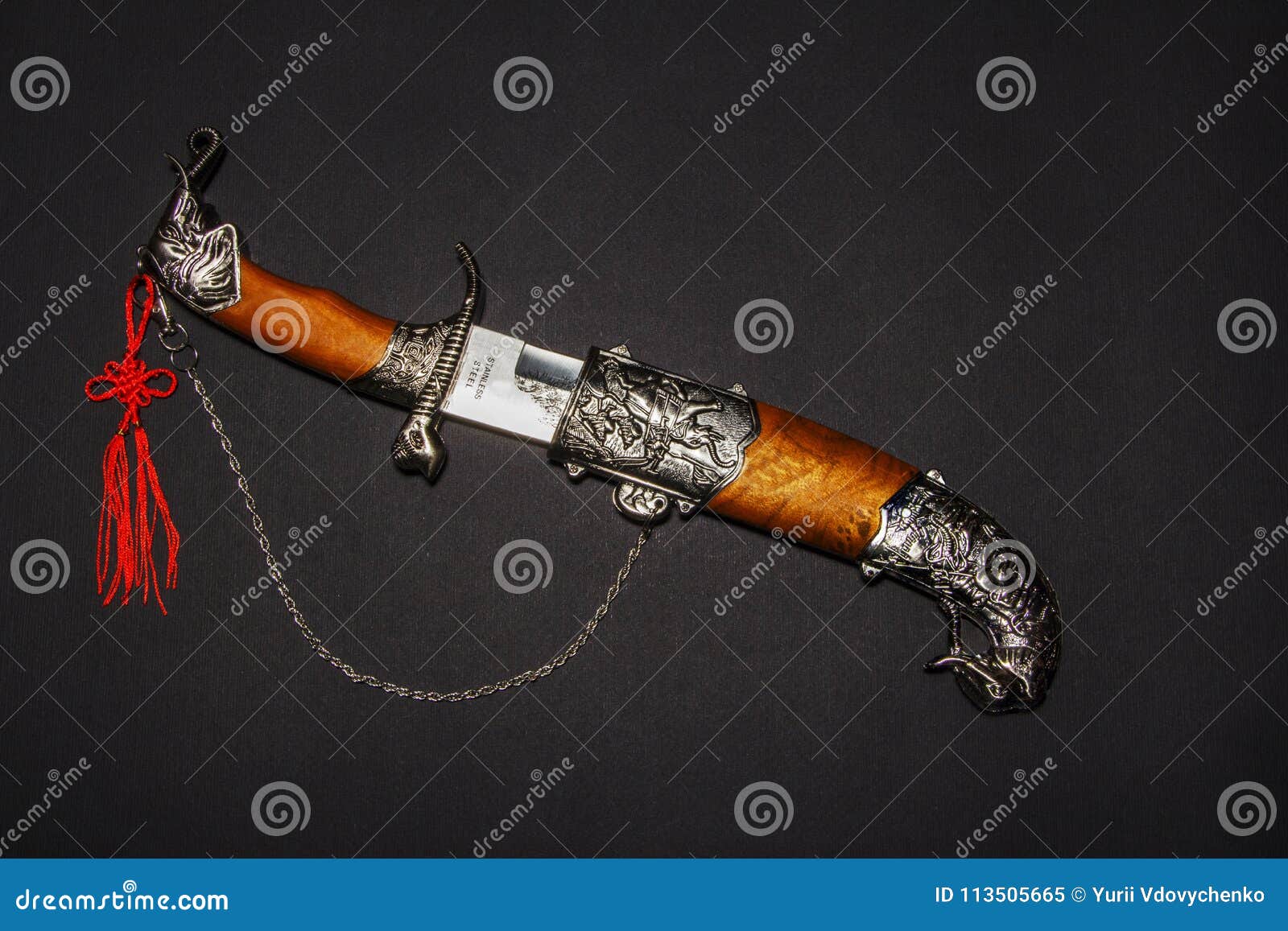 Curved Ceremonial Dagger With Ornate Sheath On A Black Background ...