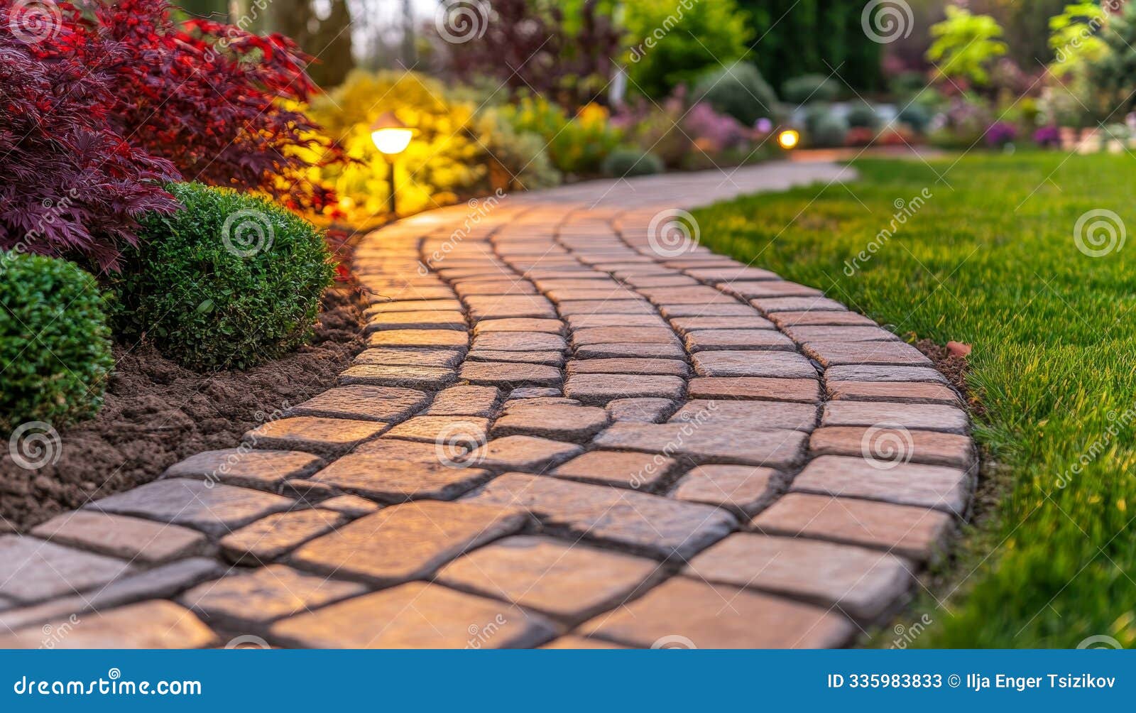 Curved Cobblestone Garden Path with Landscape Lighting at Twilight ...