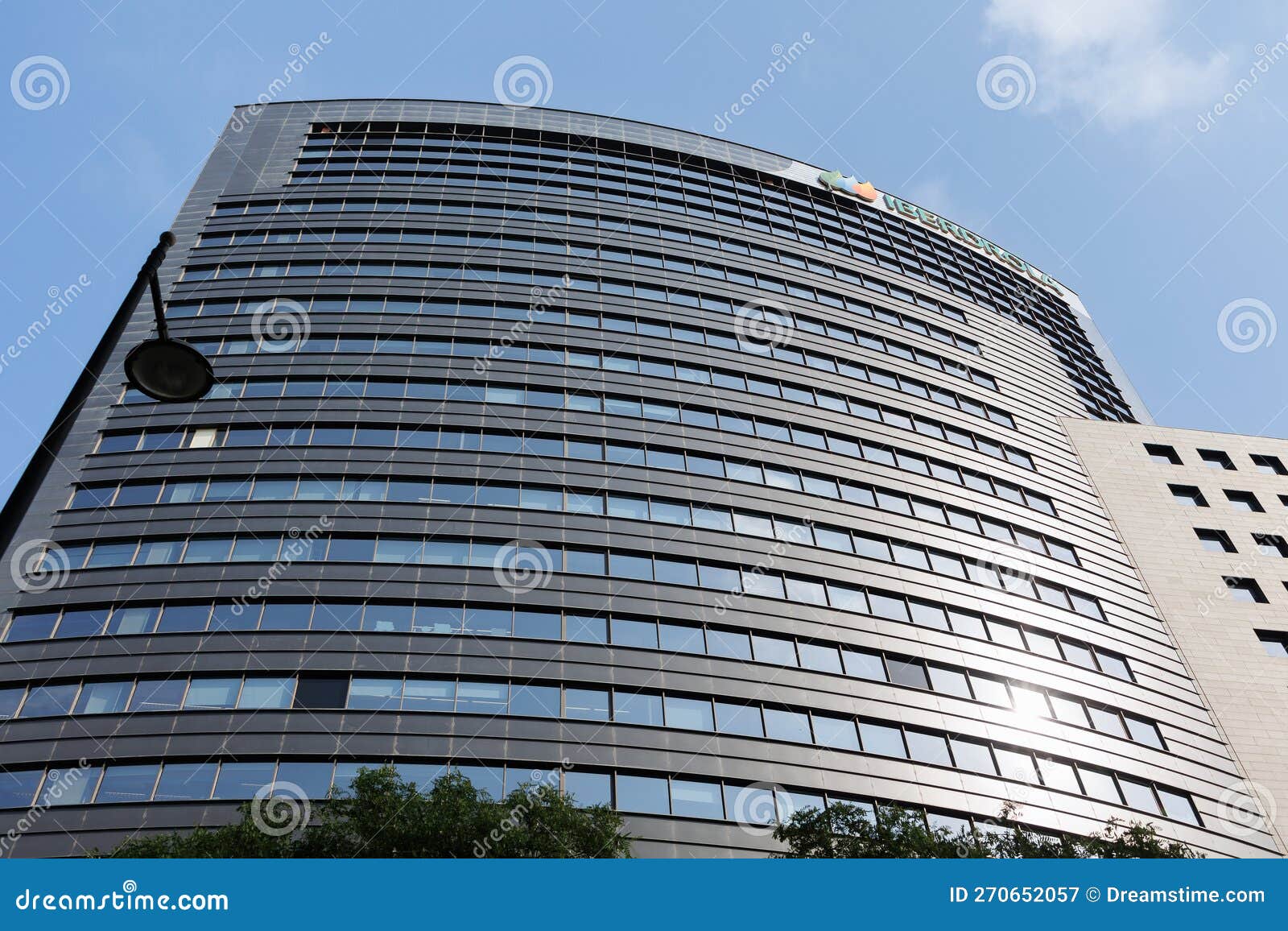 Curved Facade of a Tall Modern Building with Mirrored Windows Editorial ...