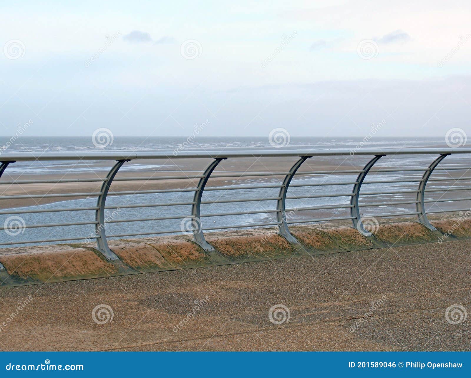 Curved Metal Railings on the Seafront in Blackpool with Waves Breaking ...
