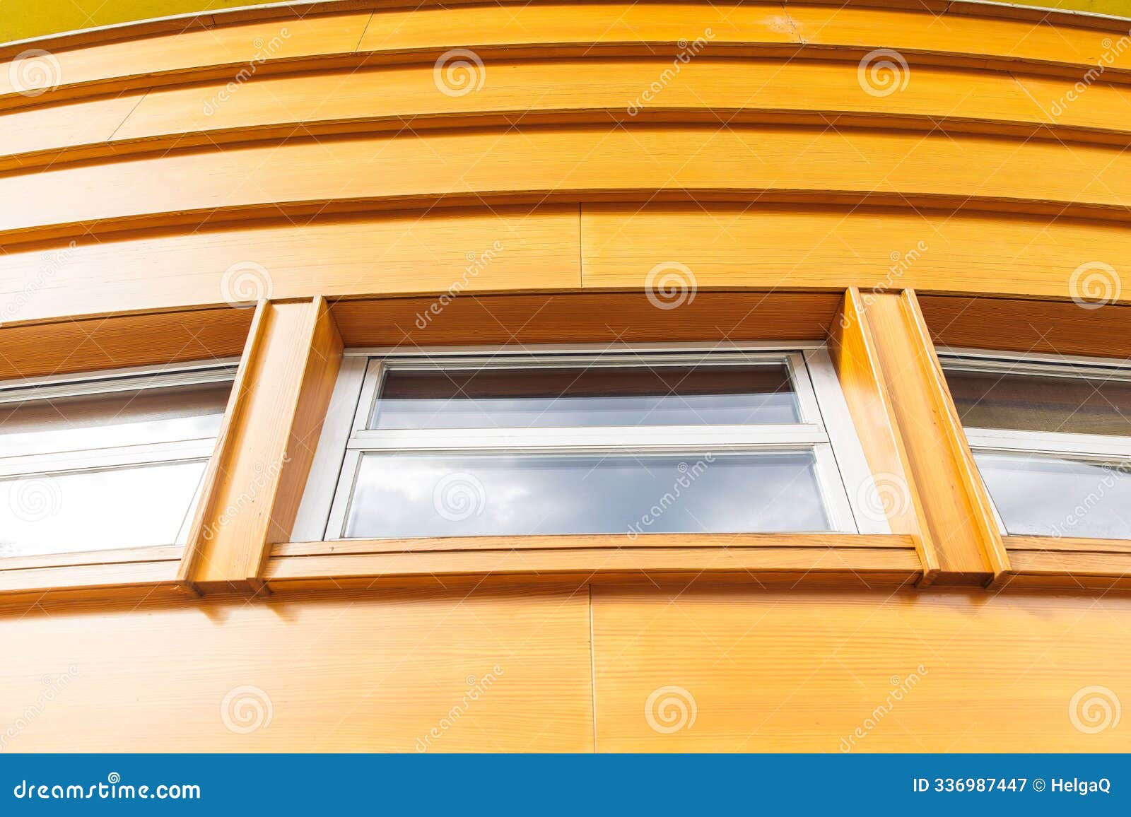 Curved Modern Wooden Facade with Geometric Design and Rectangular ...