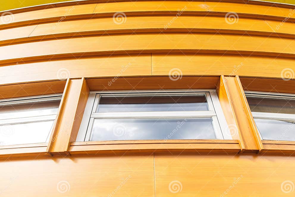 Curved Modern Wooden Facade with Geometric Design and Rectangular ...