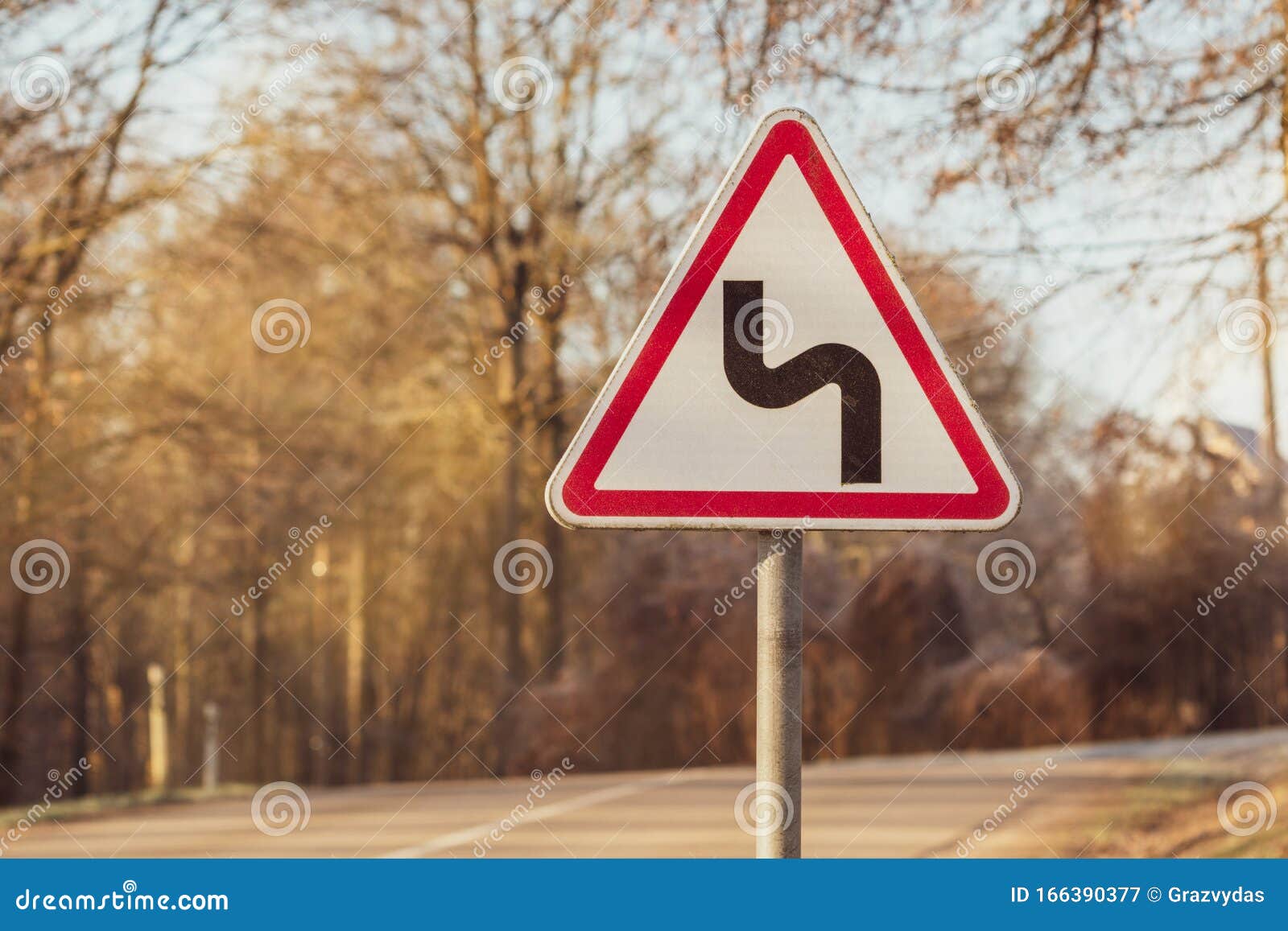 Curved road traffic sign stock image. Image of outdoor - 166390377