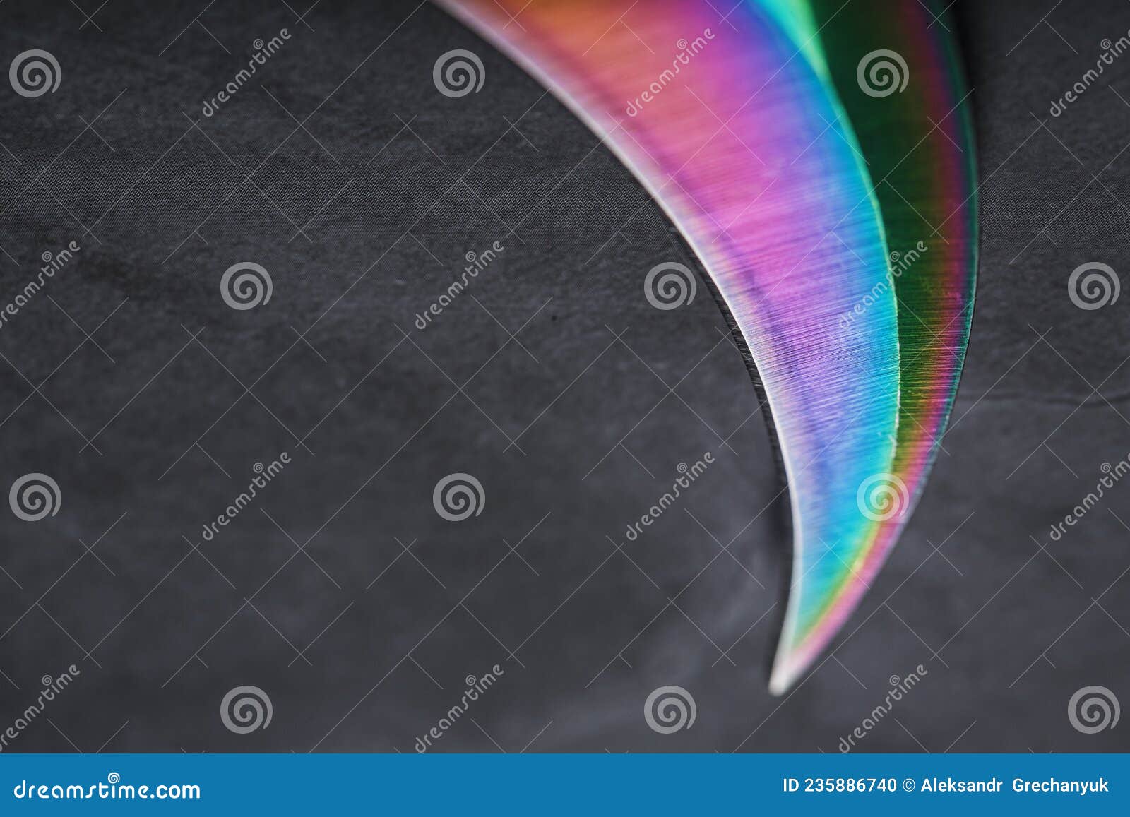 The Curved Sharp Blade of the Kerambit Dagger is a Gradient Rainbow ...