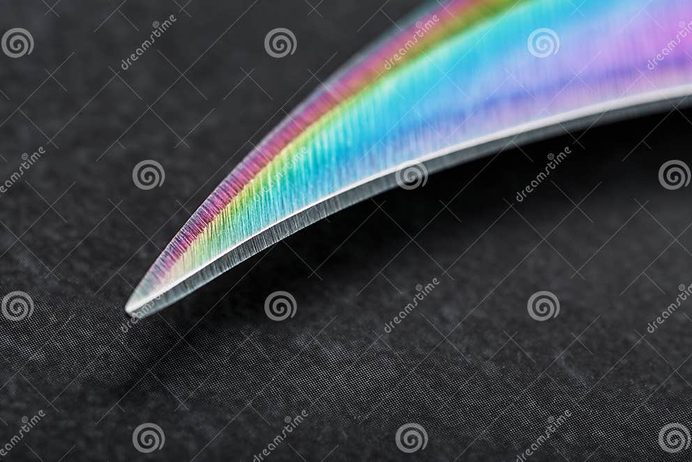 The Curved Sharp Blade of the Kerambit Dagger is a Gradient Rainbow ...