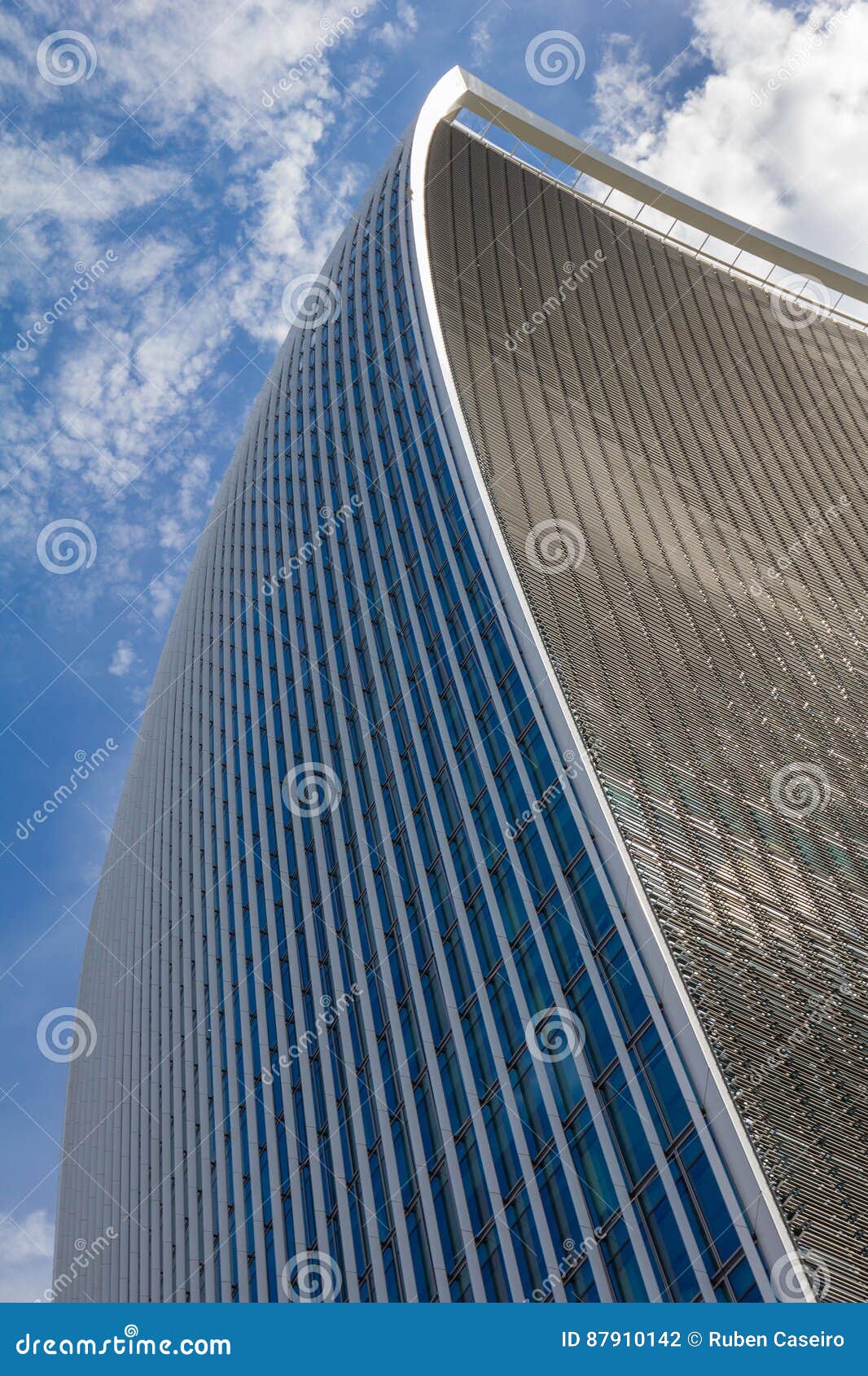 Curved Skyscraper Against Blue Sky Stock Photo - Image of background ...