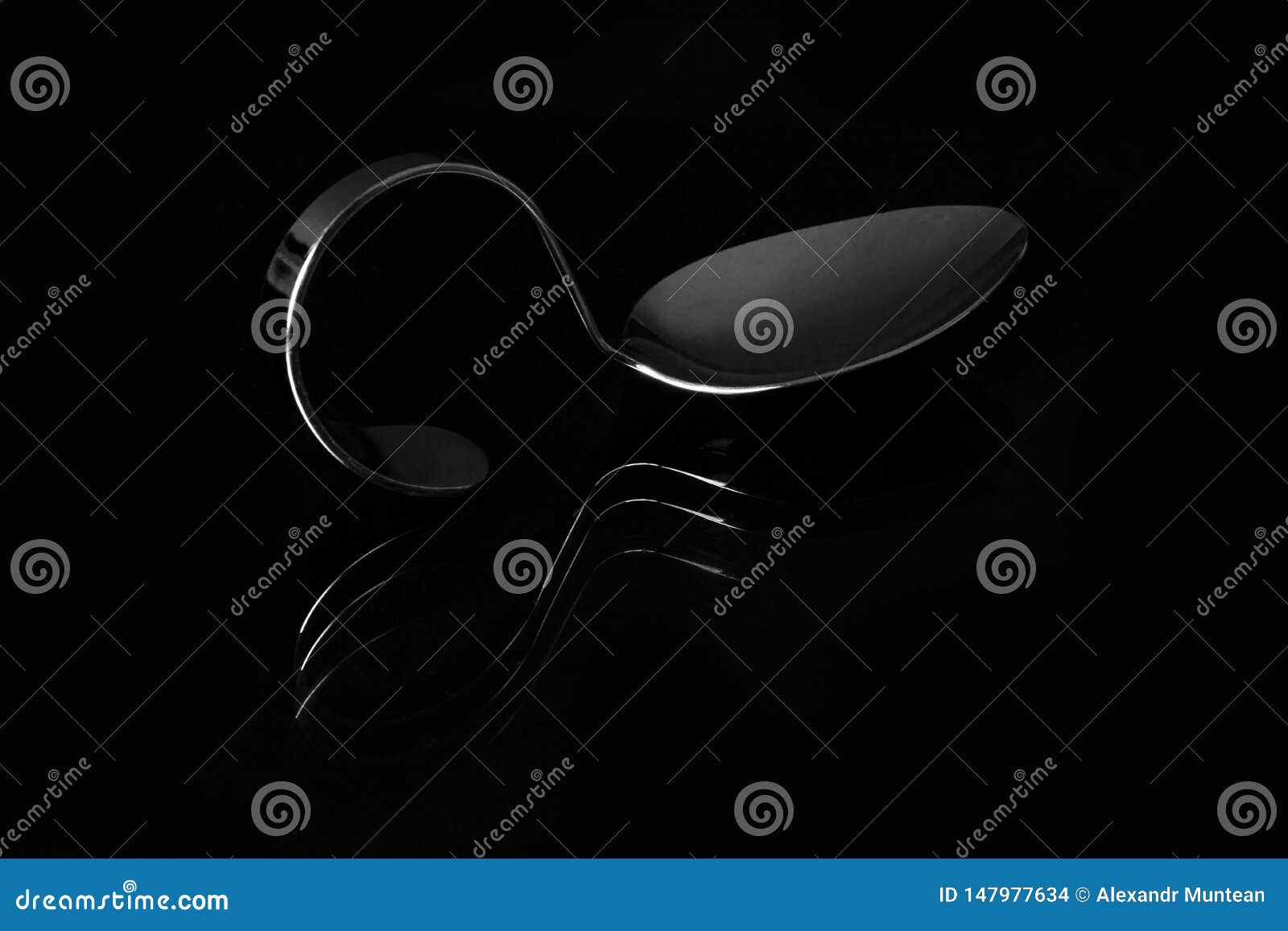 Curved spoon stock photo. Image of chrome, smooth, detail - 147977634
