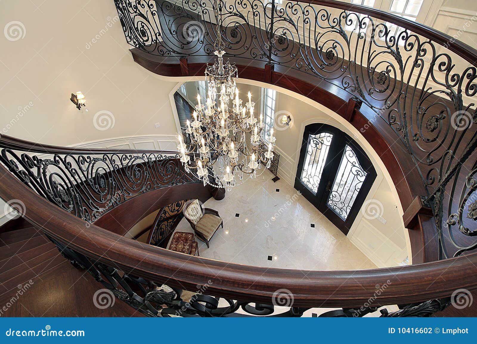 Curved Stairway Leading Down into Foyer Stock Photo - Image of room ...