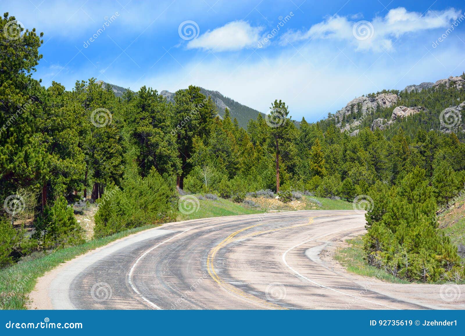Curved Weathered Asphalt Mountain Road on a Sunny Day Stock Image ...
