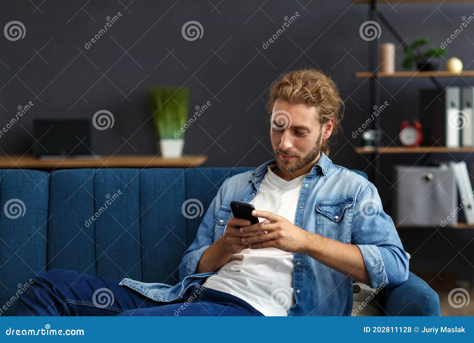 Curvy Guy Using Smartphone and Smiling. Happy Man Using Mobile Phone ...