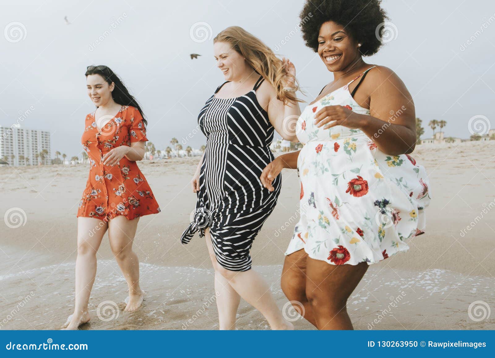 Curvy women at the beach stock photo. Image of friends - 130263950