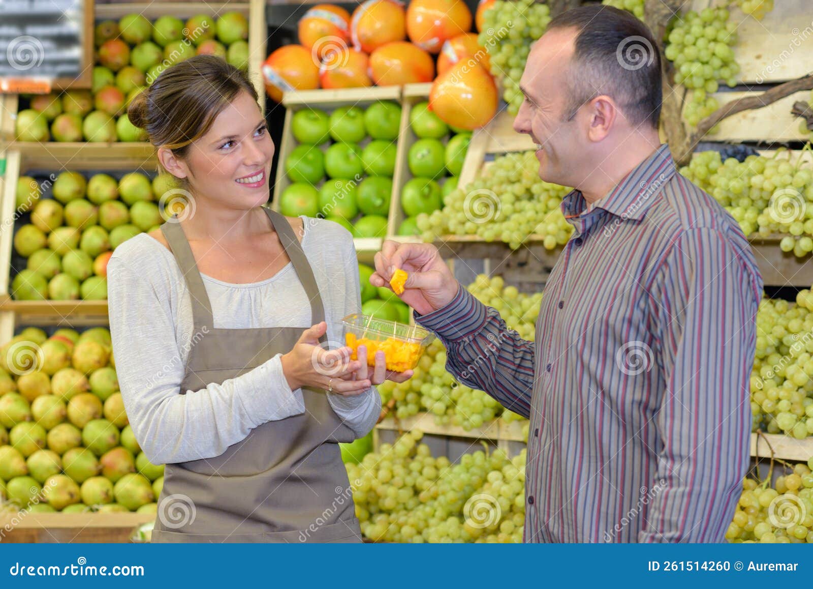 Customer Accespting Taster in Fruit Aisle Stock Photo - Image of ...