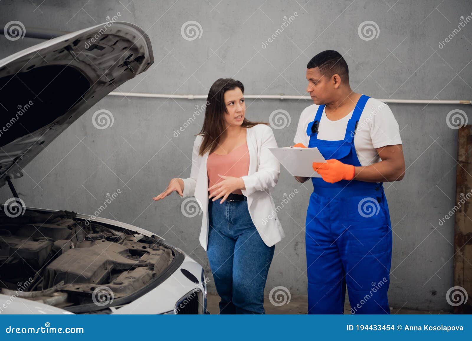 Customer Asks Repairer To Fix Car Engine Stock Photo - Image of ...
