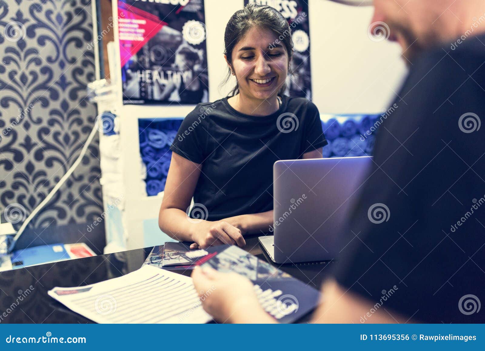 A Customer Checking in at Gym Counter Stock Photo - Image of operation ...