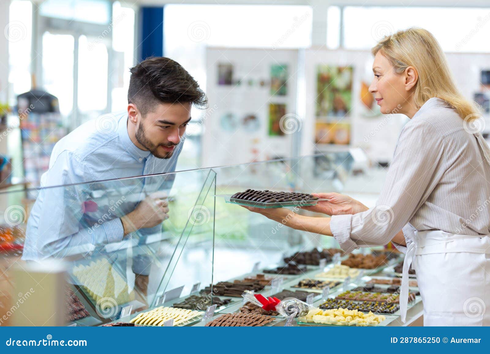 Customer Choosing Delicious Chocolate in Shelf Stock Photo - Image of ...