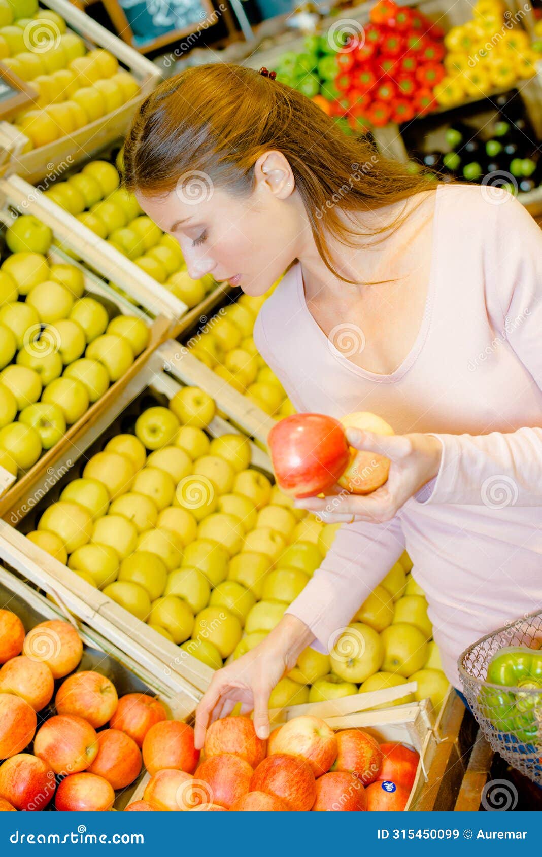 Customer choosing fruit stock image. Image of organic - 315450099