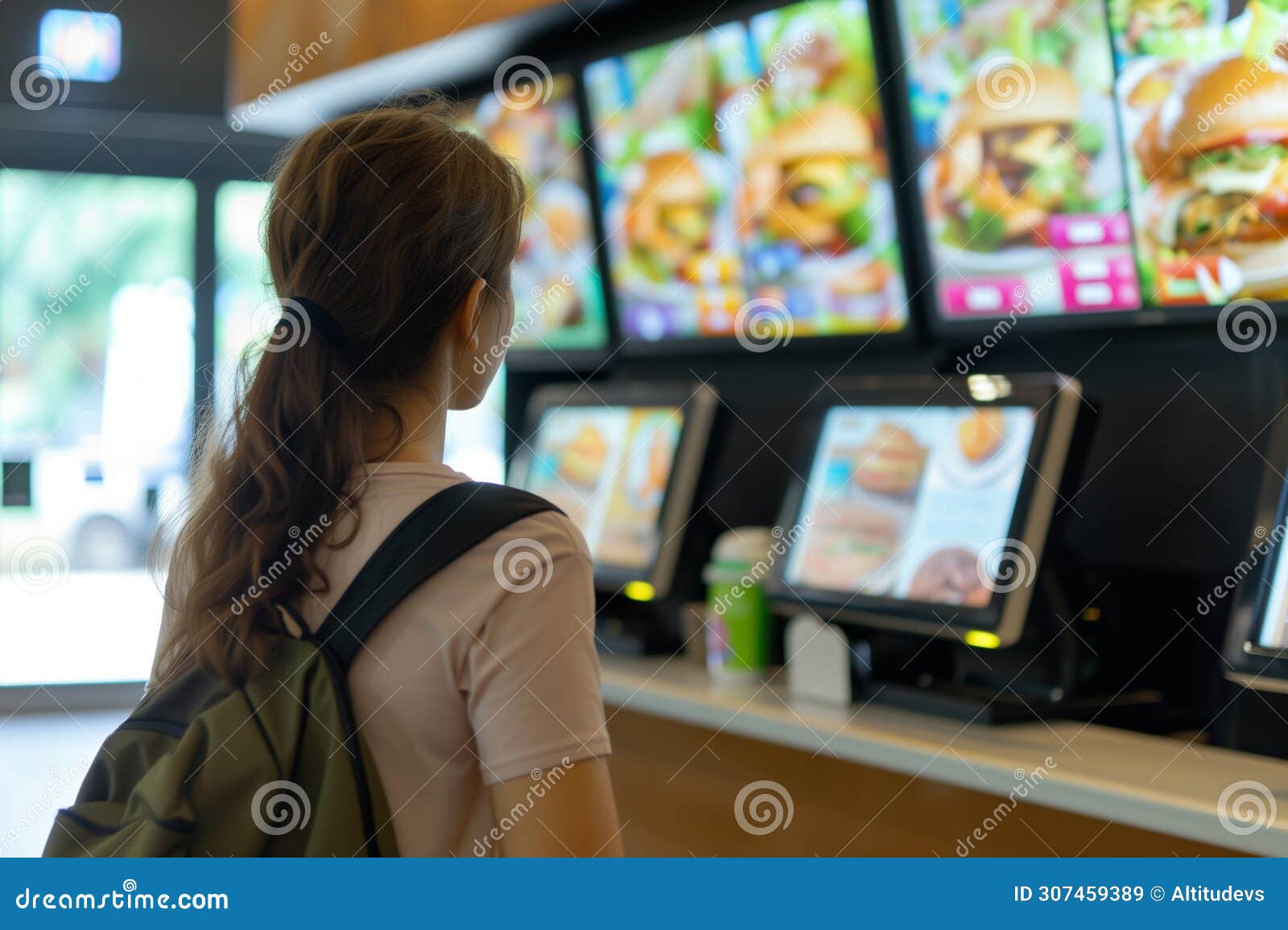 Customer at a Concession Stand with Digital Menu Boards Stock Image ...