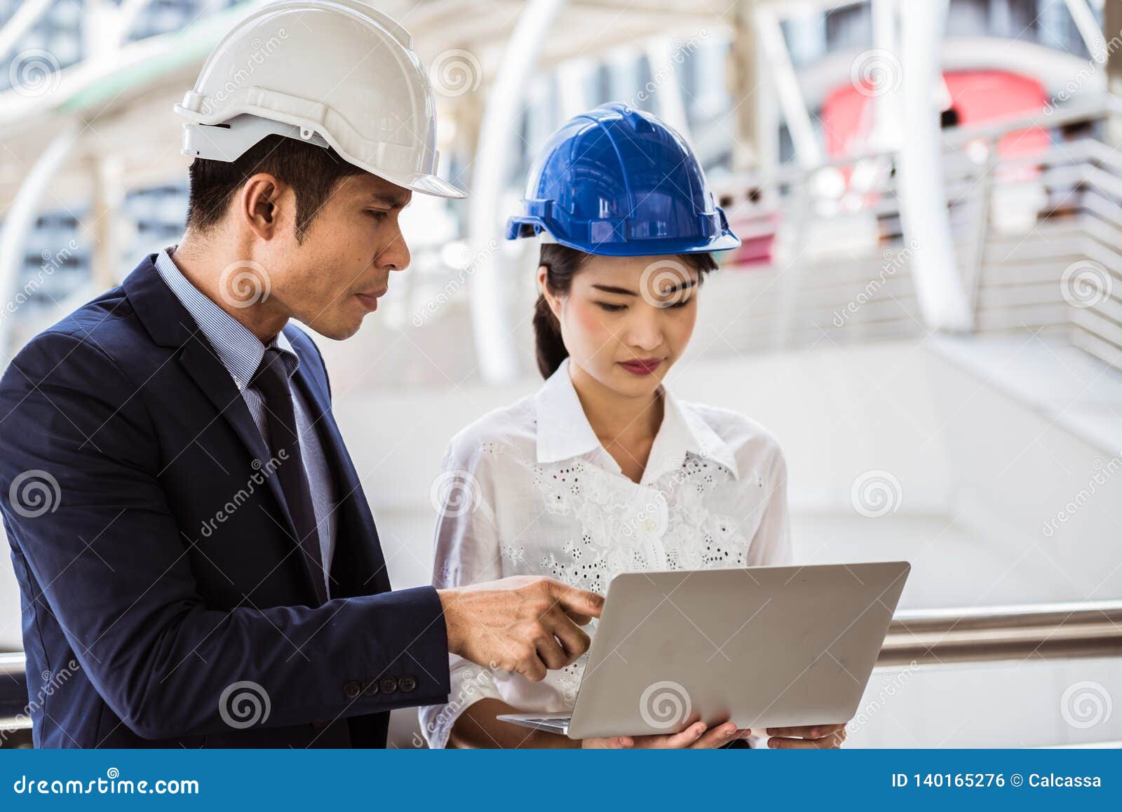 Customer Discussing with Young Engineer Stock Photo - Image of building ...