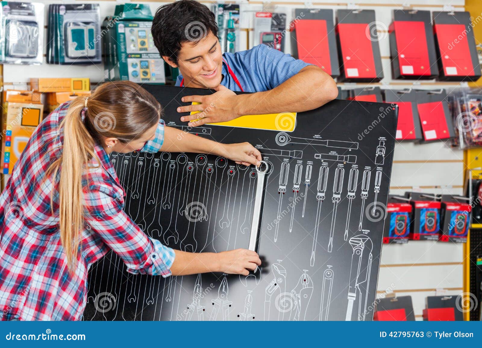 Customer Examining Wrench Using Board in Store Stock Image - Image of ...
