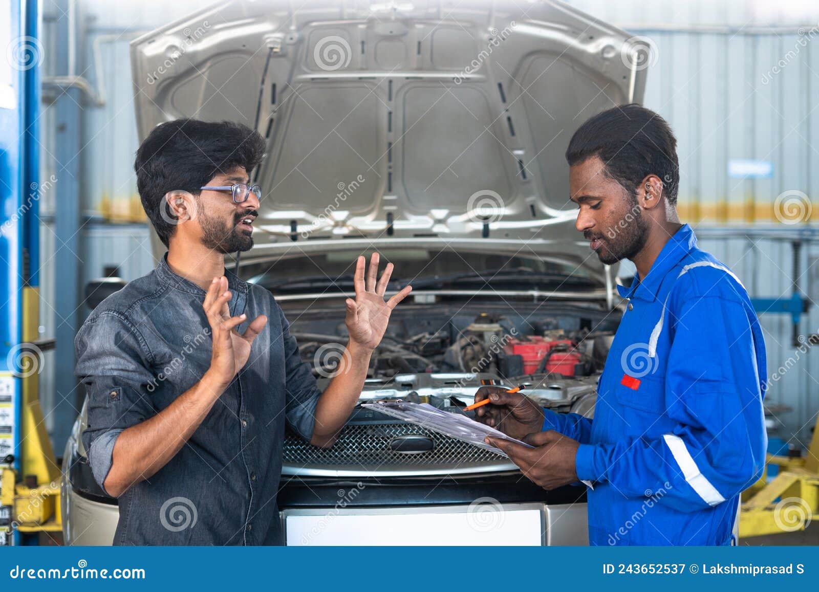 Customer Explaining Car Engine Problem while Mechanic Noting Problems ...