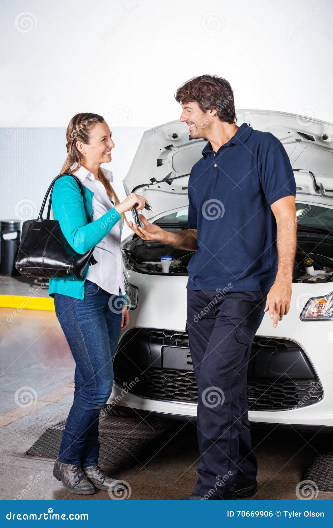 Customer Giving Car Keys To Technician at Garage Stock Photo - Image of ...