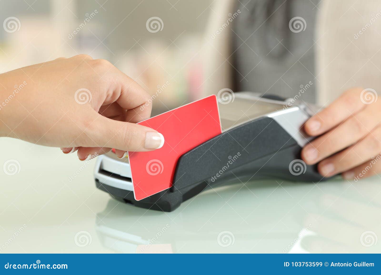 Customer Hand Passing Credit Card through the Reader Stock Image ...
