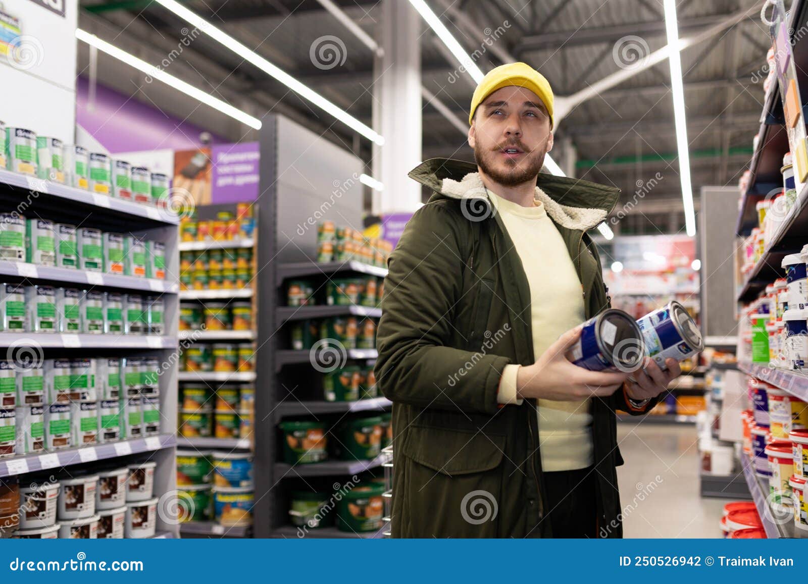 A Customer in a Hardware Store Selects the Right Paint for Interior ...