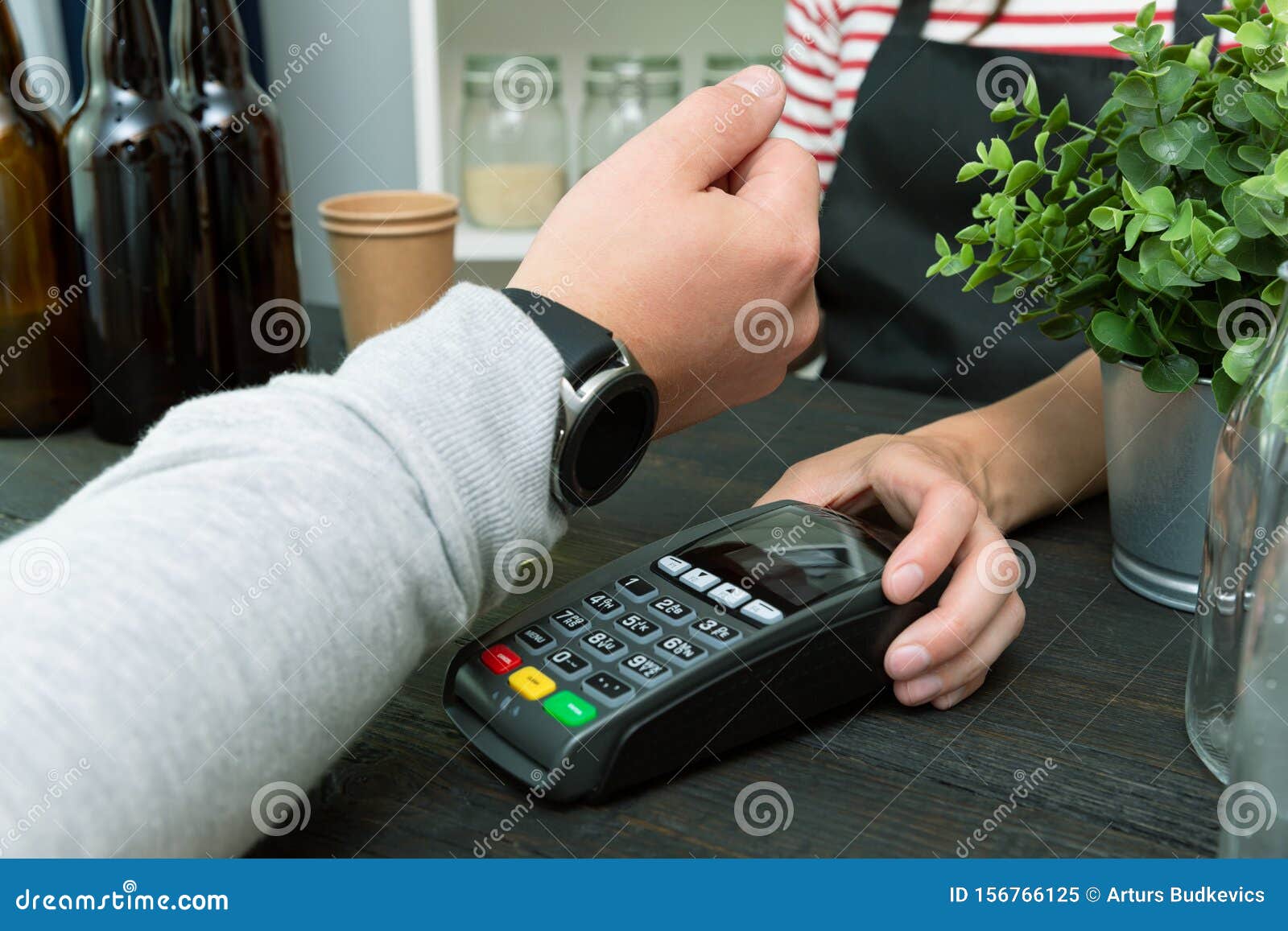 Customer Making Wireless or Contactless Payment Using Smartwatch. Store ...