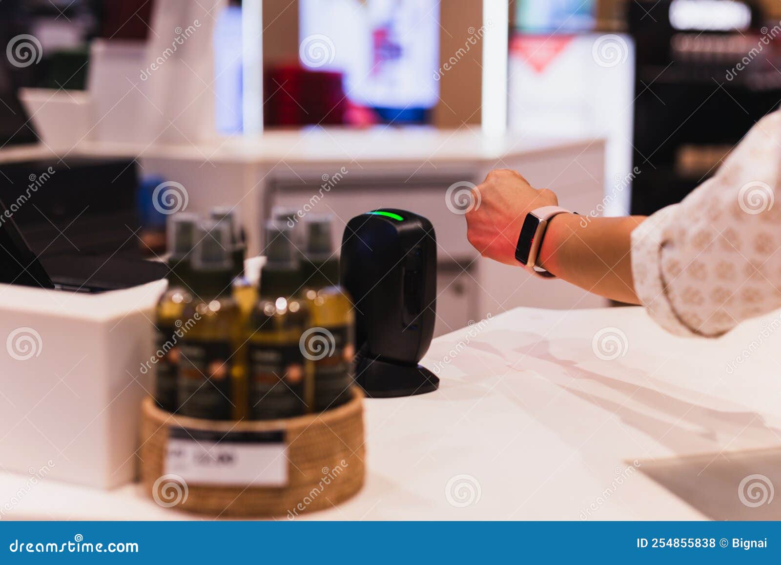 Customer Making Wireless Payment Using Smartwatch at Shopping Store ...