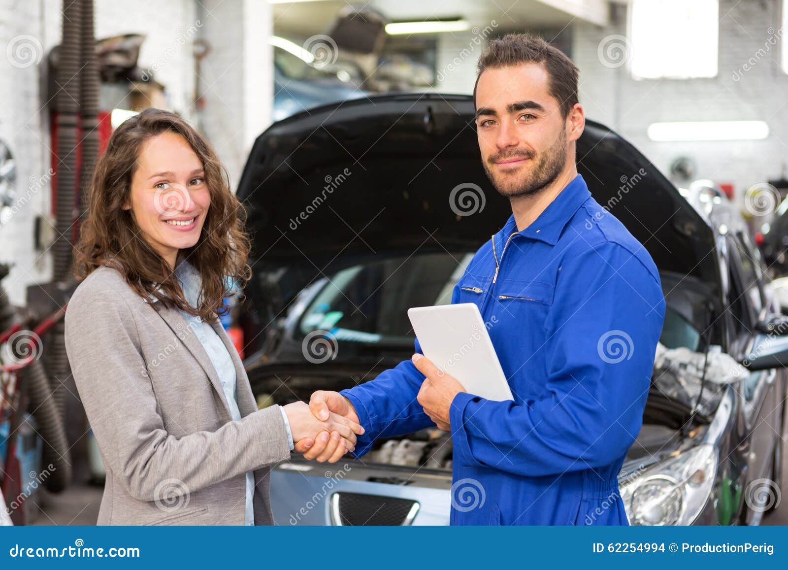 Customer and Mechanic at the Garage Stock Photo - Image of woman ...