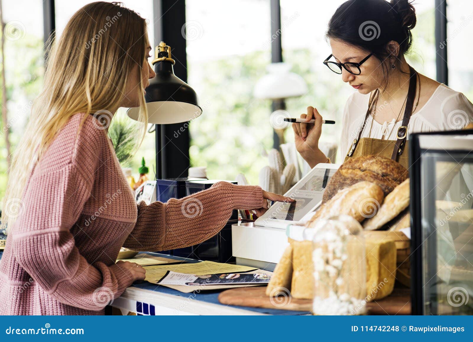 Customer Ordering Pastry at Counter Stock Photo - Image of owner, menu ...