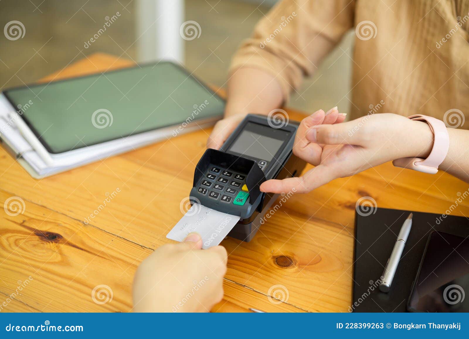 Customer Paying by Credit Card, Insert Credit Card into Payment Machine ...