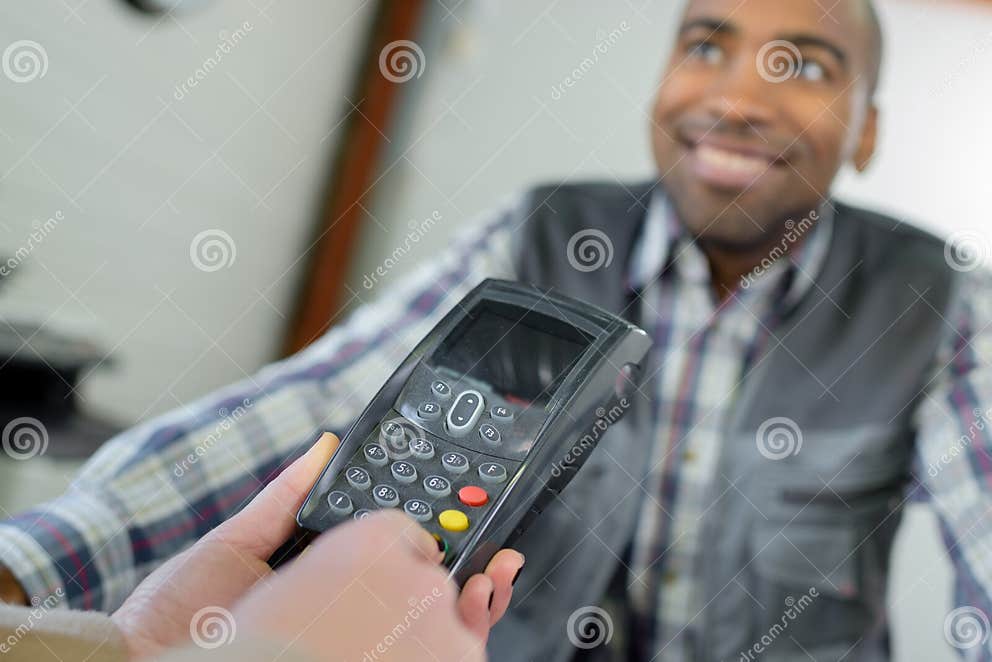 Customer Paying for Services by Card at Till Stock Photo - Image of ...