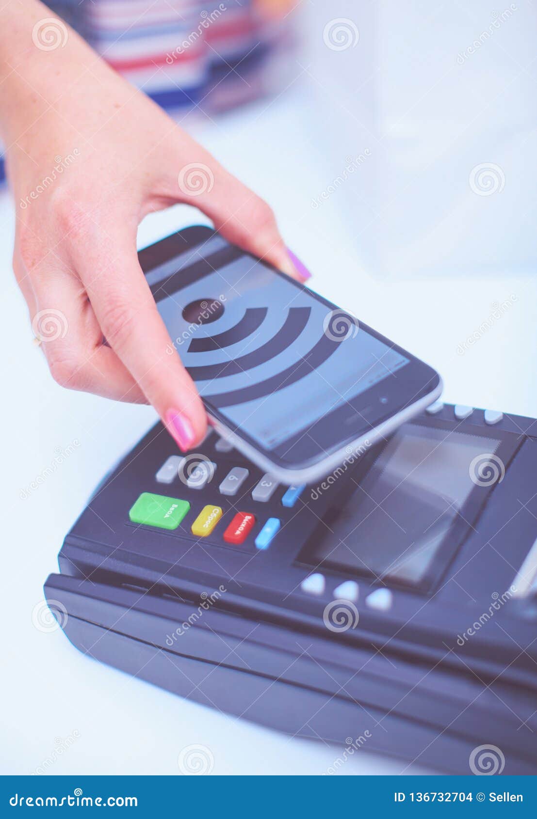 Customer is Paying with Smartphone in Shop Using NFC Technology. NFC ...