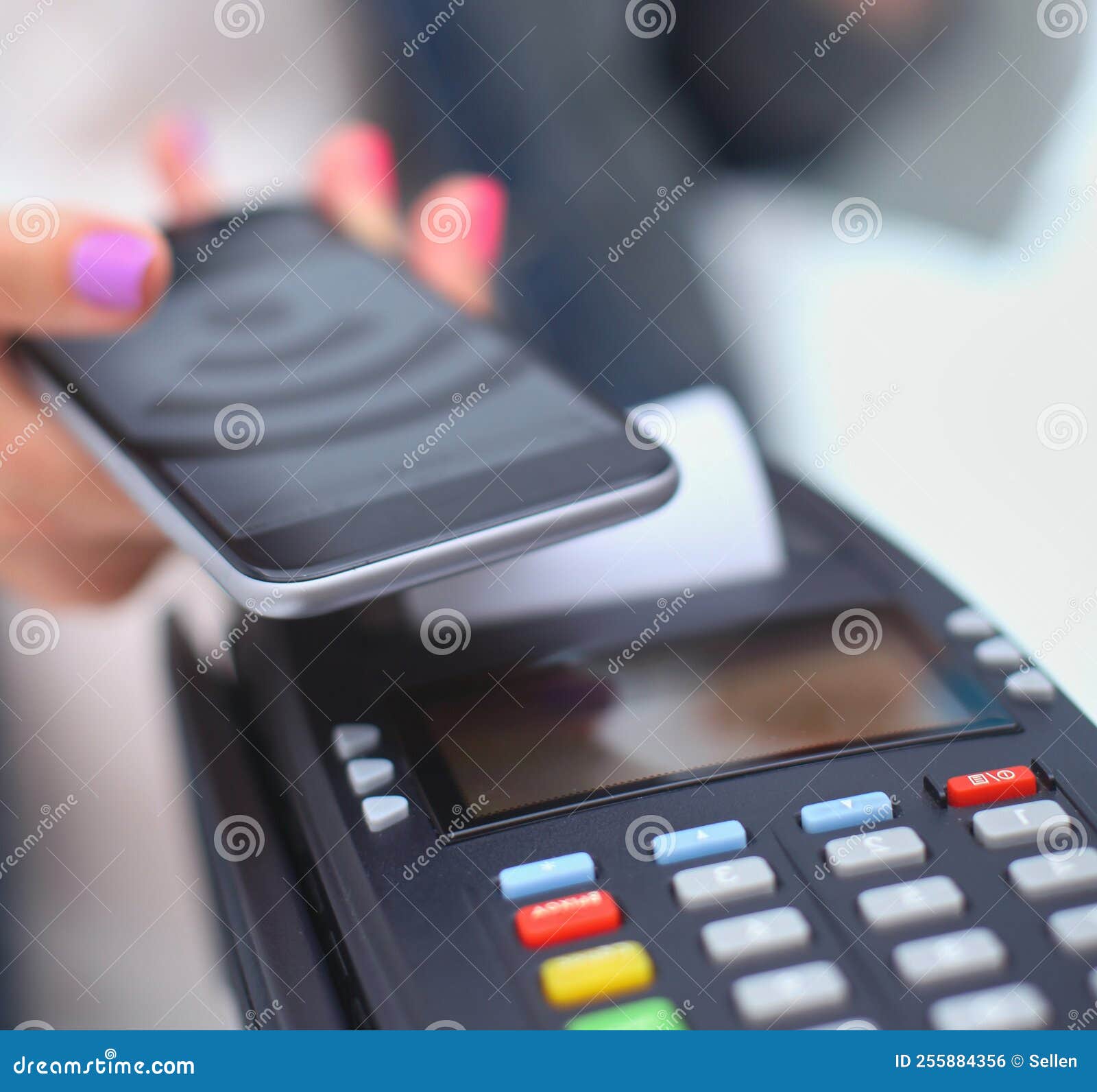 Customer is Paying with Smartphone in Shop Using NFC Technology. NFC ...