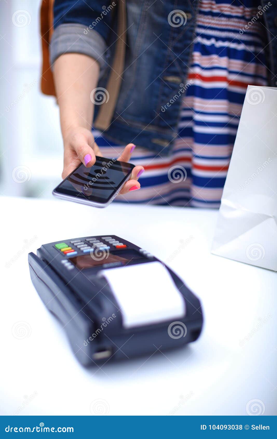 Customer is Paying with Smartphone in Shop Using NFC Technology. NFC ...