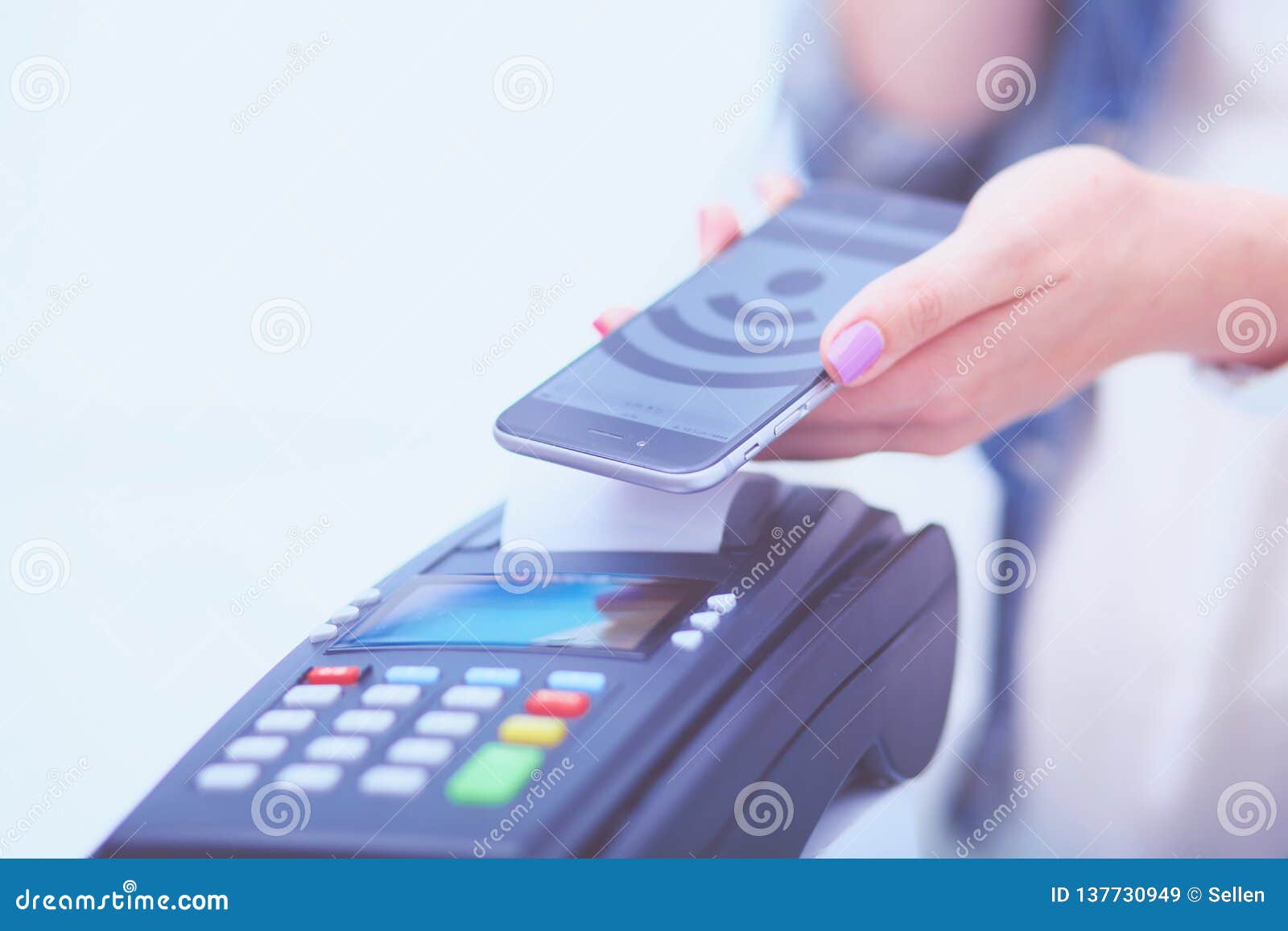 Customer is Paying with Smartphone in Shop Using NFC Technology. NFC ...