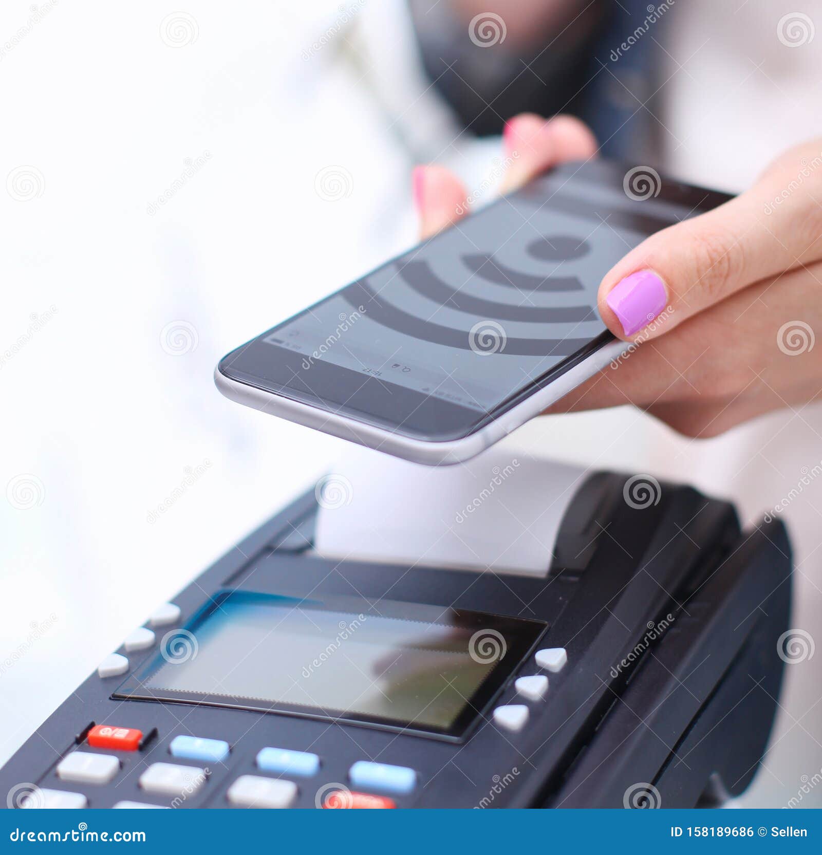 Customer is Paying with Smartphone in Shop Using NFC Technology. NFC ...