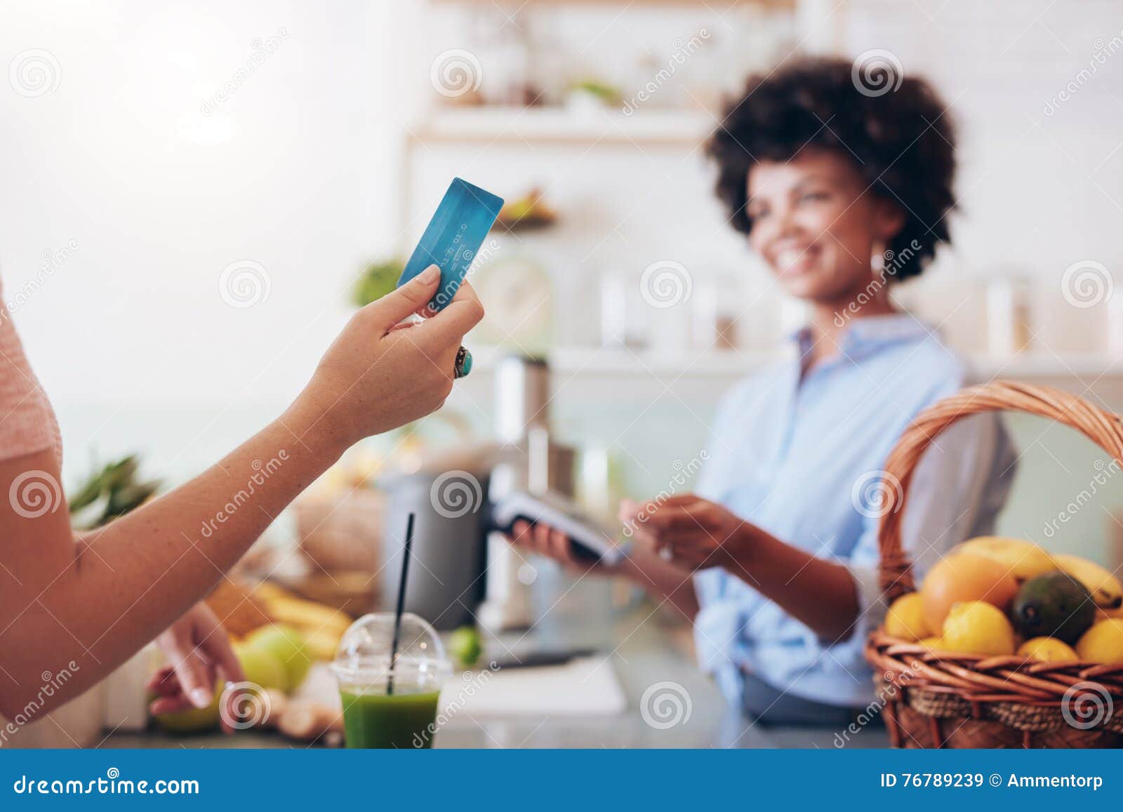 Customer Paying for Their Order with a Credit Card in Juice Bar Stock ...