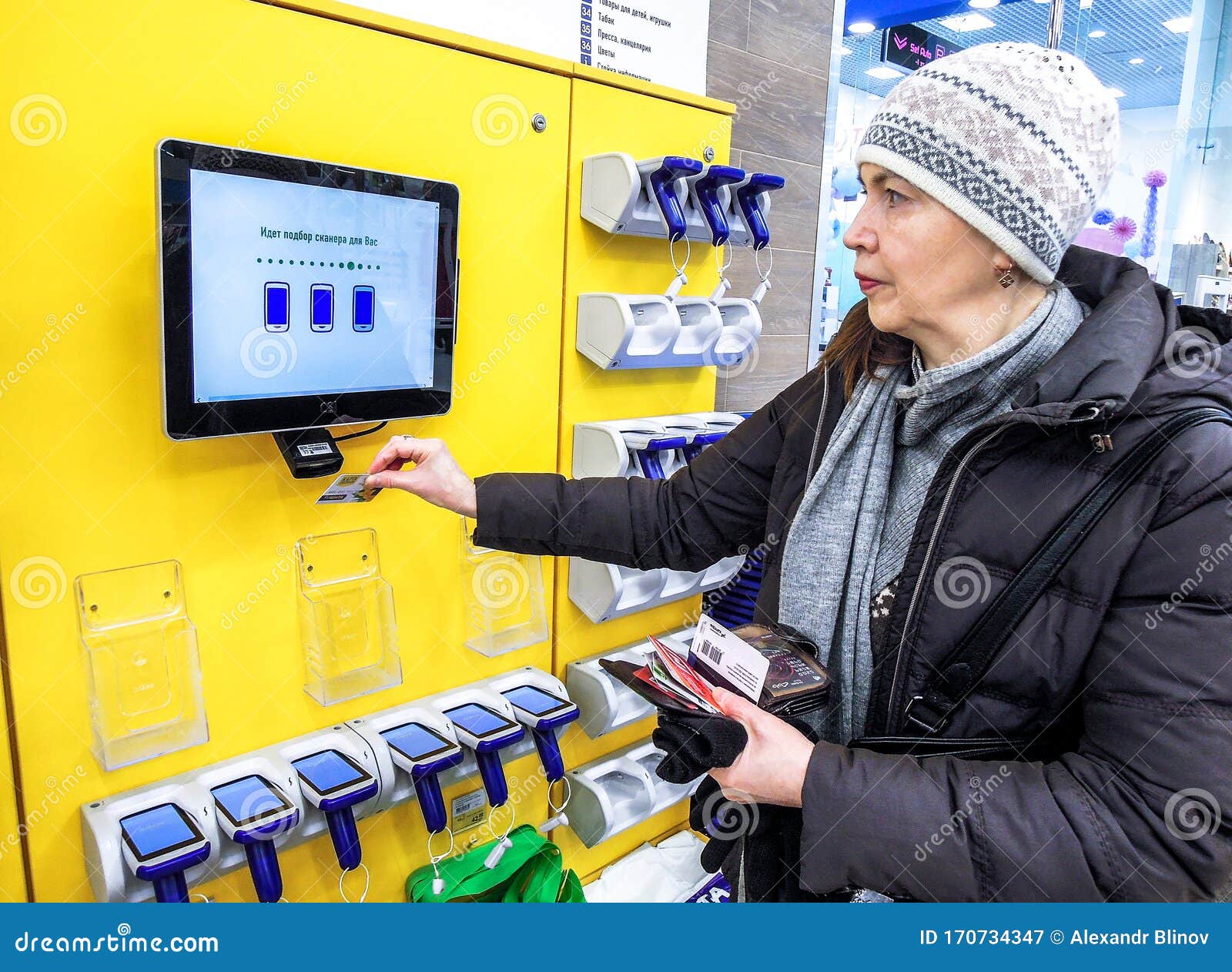 Customer Selects a Barcode Scanner in the Lenta Store Editorial ...