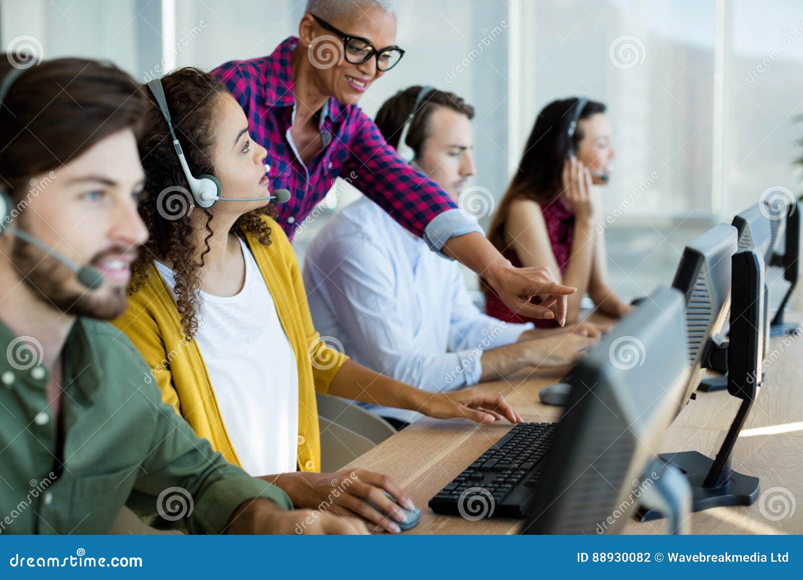 Customer Service Executive Trainer Assisting Her Team Stock Photo ...