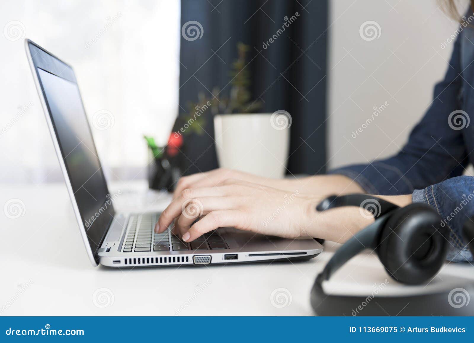 Customer Service Representative Working on Laptop at Desk in Off Stock ...