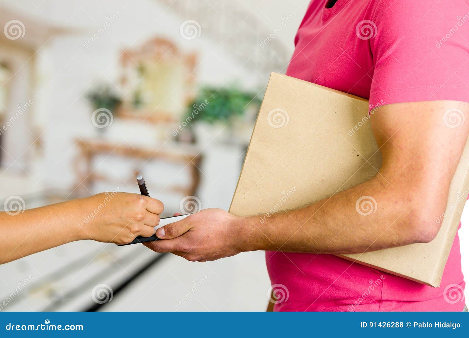 Customer Signing for Delivery from Courier Stock Photo - Image of ...