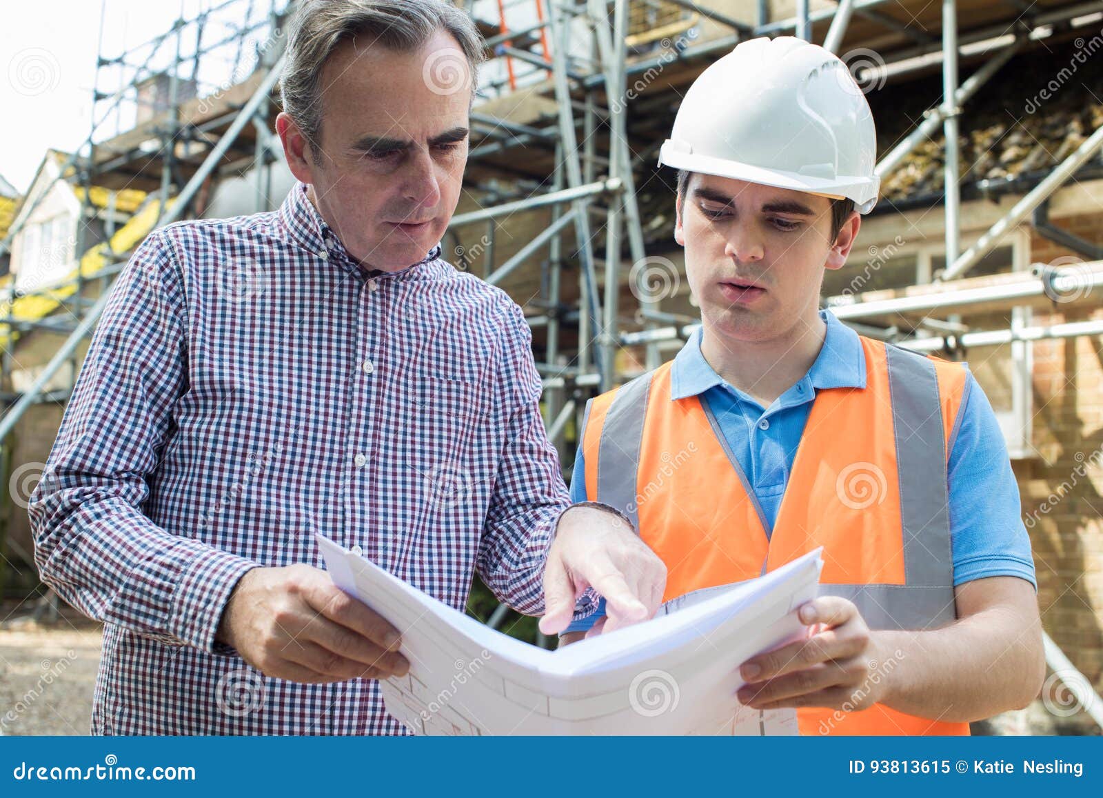 Customer on Site Discussing Plans with Builder Stock Image - Image of ...