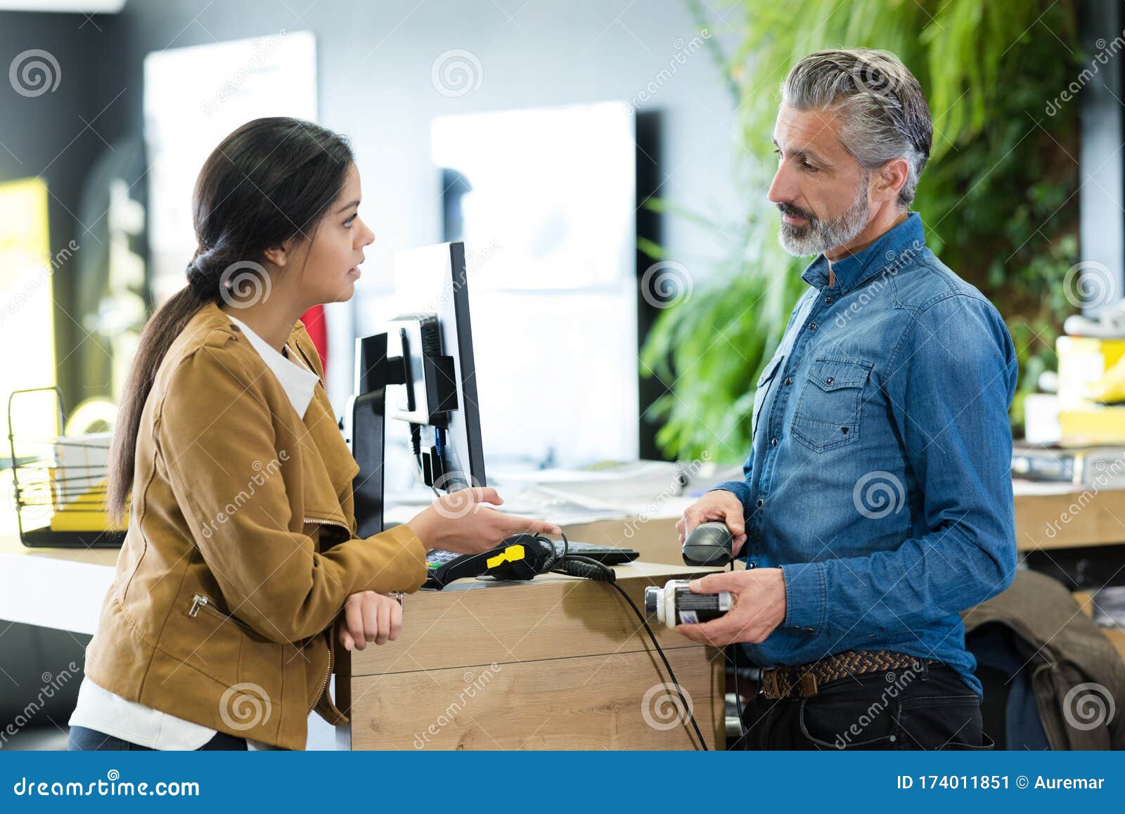 Customer Talking To Man Holding Scanner in Store Stock Image - Image of ...