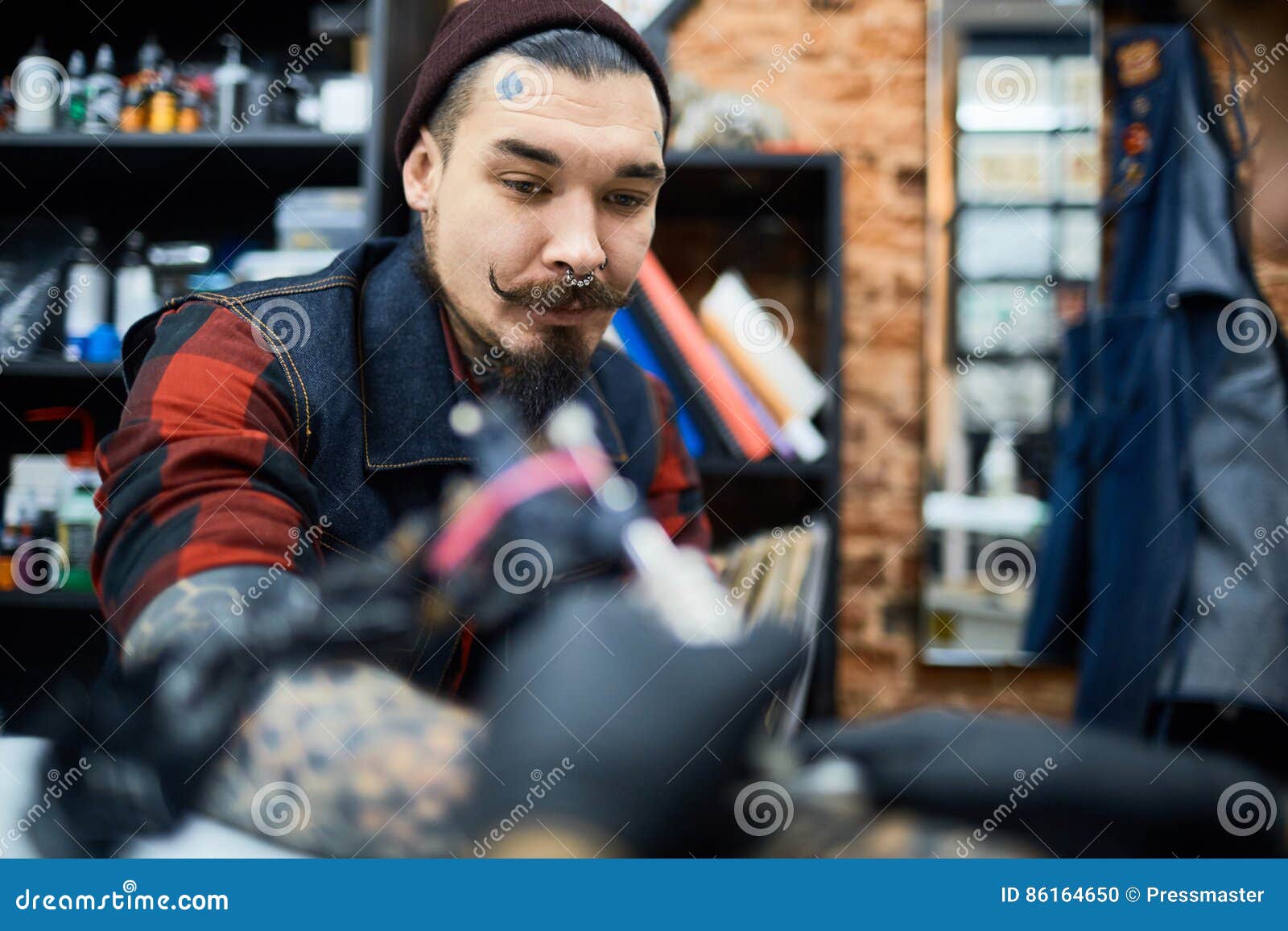 Customer of tattoo-salon stock photo. Image of alternative - 86164650