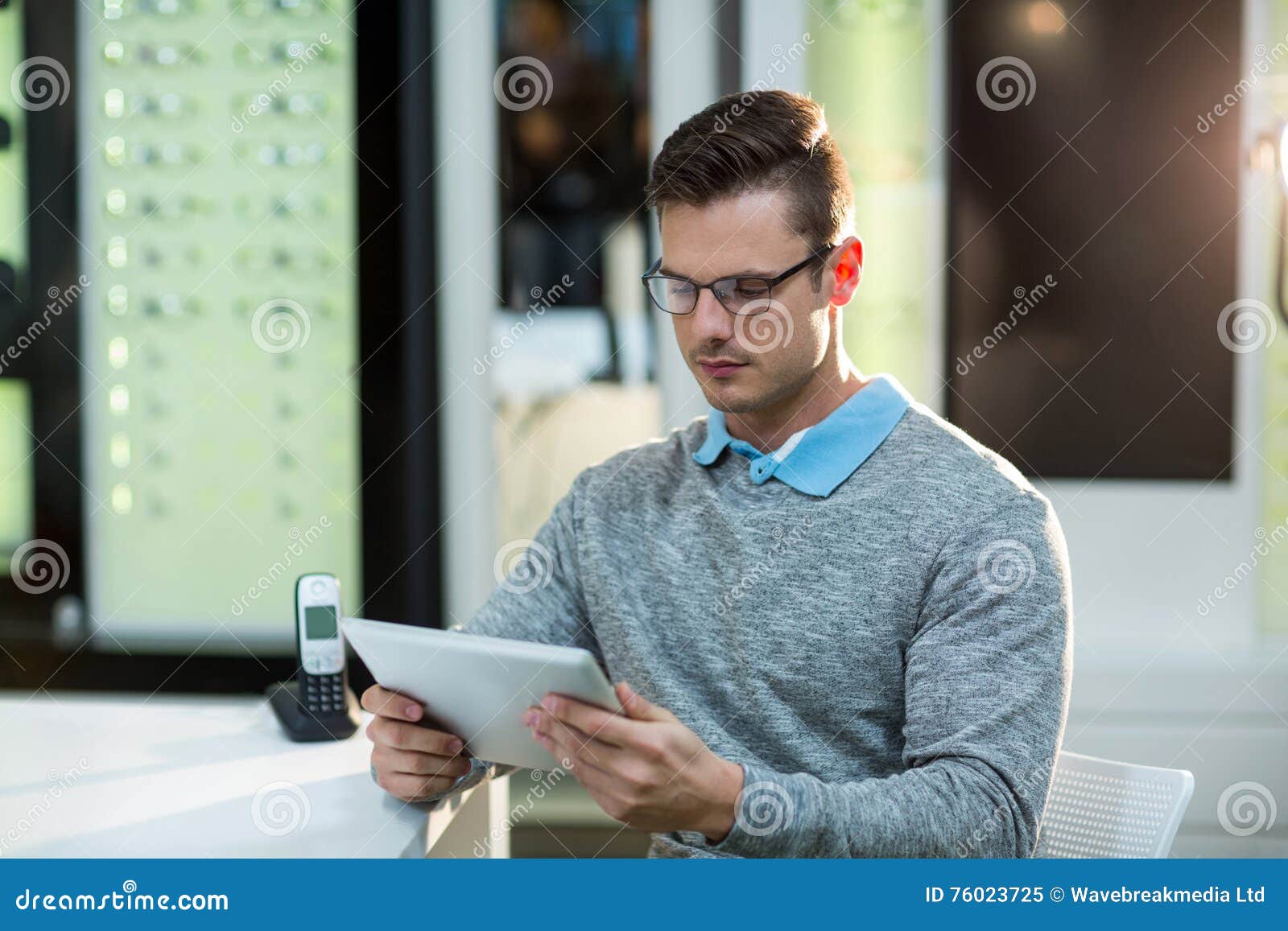Customer Using Digital Tablet in Optical Store Stock Image - Image of ...