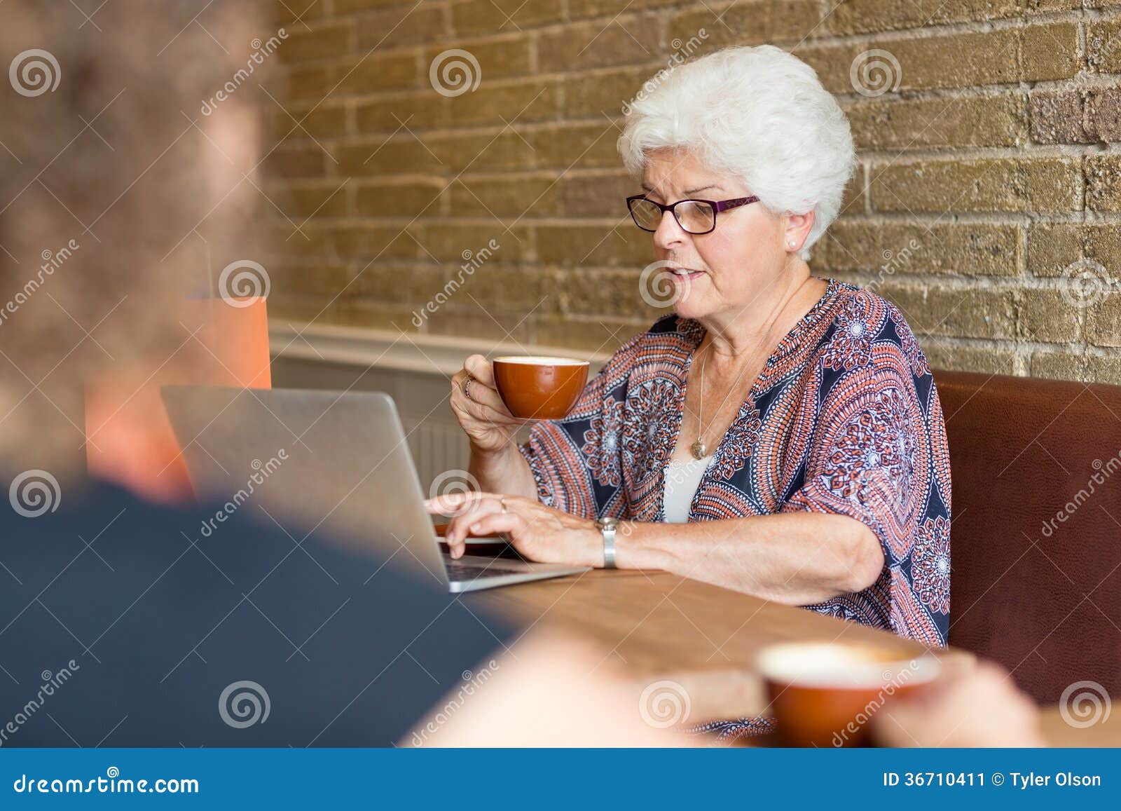 Customer Using Laptop while Having Coffee in Cafe Stock Image - Image ...