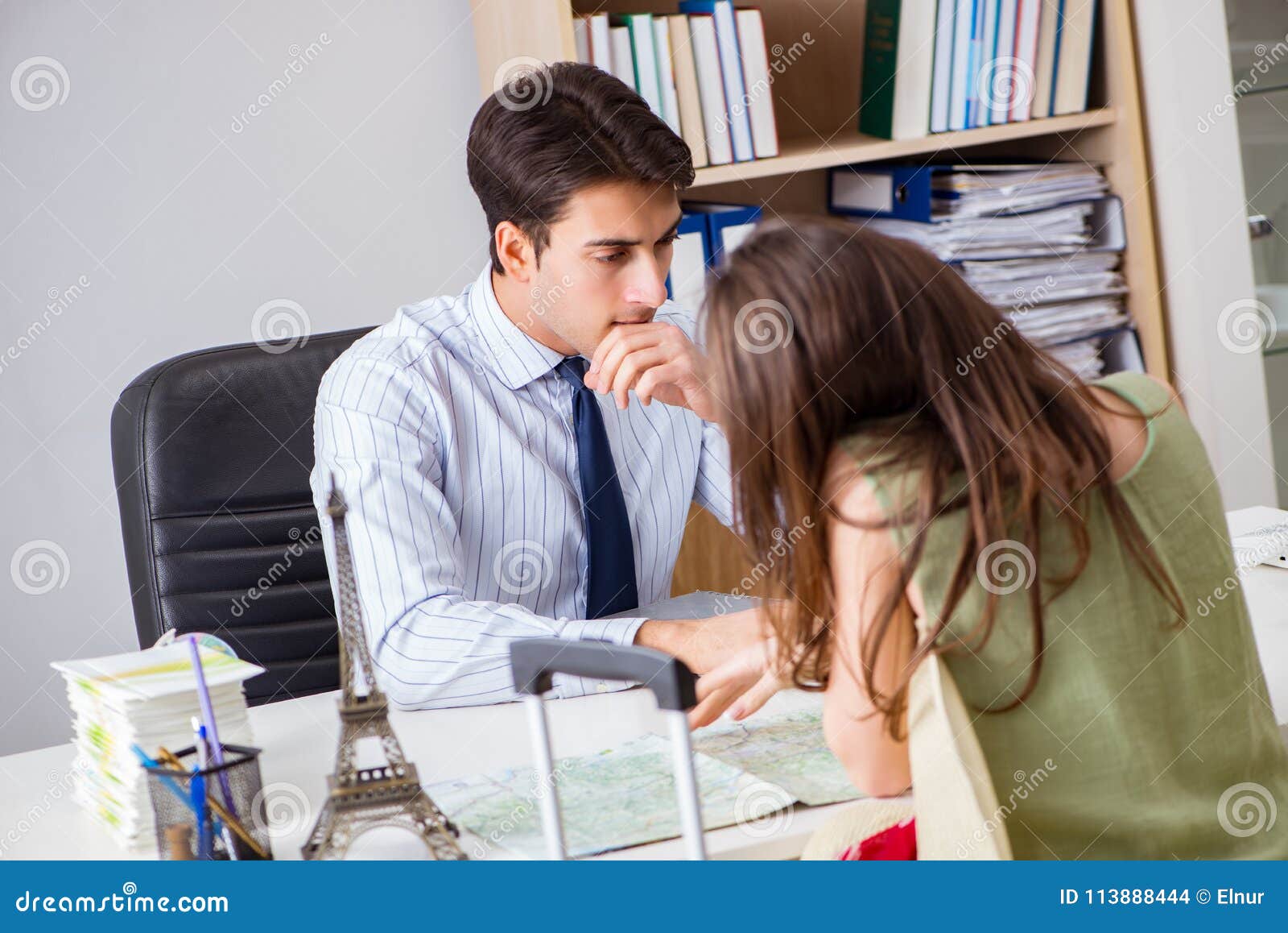 The Customer Visiting Travel Agency and Talking To Agent Stock Photo ...
